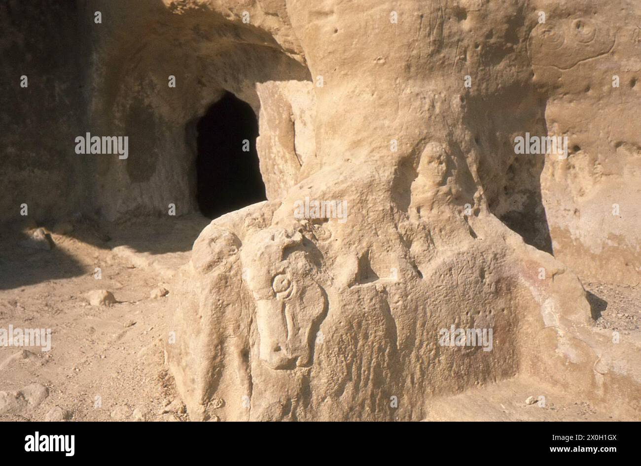 Cave houses and burial caves in Malta on Crete and figures carved in ...