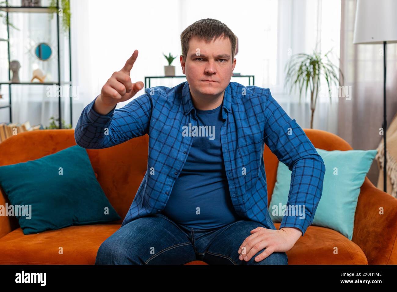 Quarrel. Displeased aggressive unhappy Caucasian young man gesturing ...