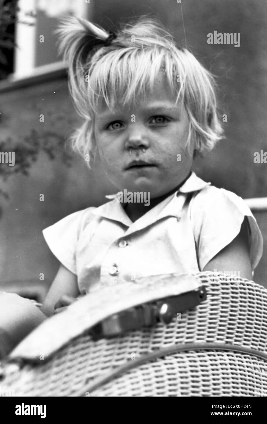 A little girl sits in her baby carriage. [automated translation] Stock ...