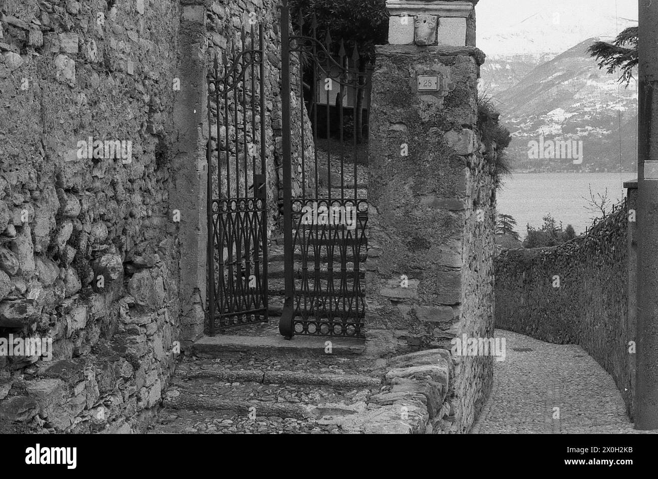 Gate in a mountain village on Lake Como in Italy Stock Photo - Alamy