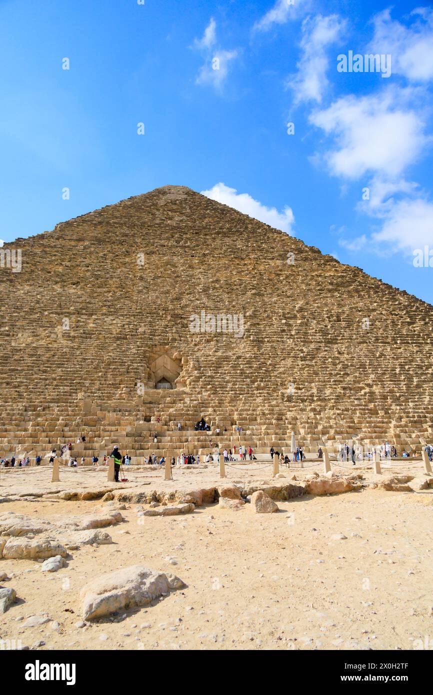 Tourists at the base of the Great Pyramids of Giza, Cairo, Egypt Stock ...