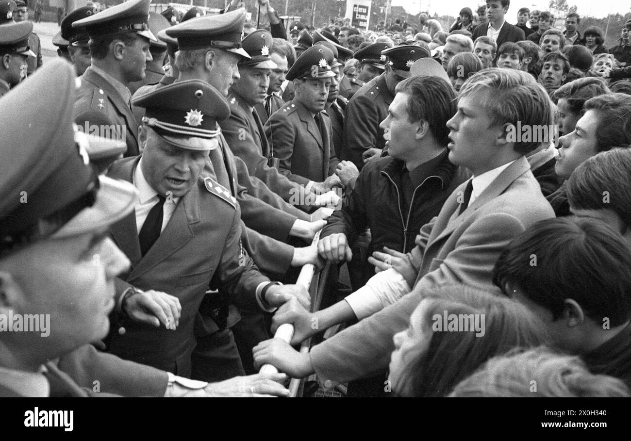 "Visitors during the Beatles concert in Essen. The police take care of ...