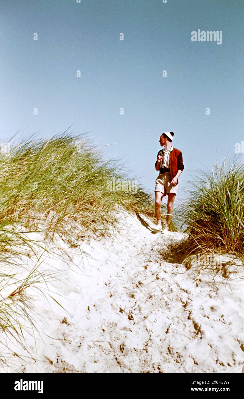 A man walks through the dunes on the Baltic Sea Stock Photo - Alamy