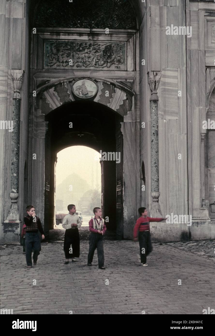 A group of boys in front of the passage of the Sultan's Gate in ...