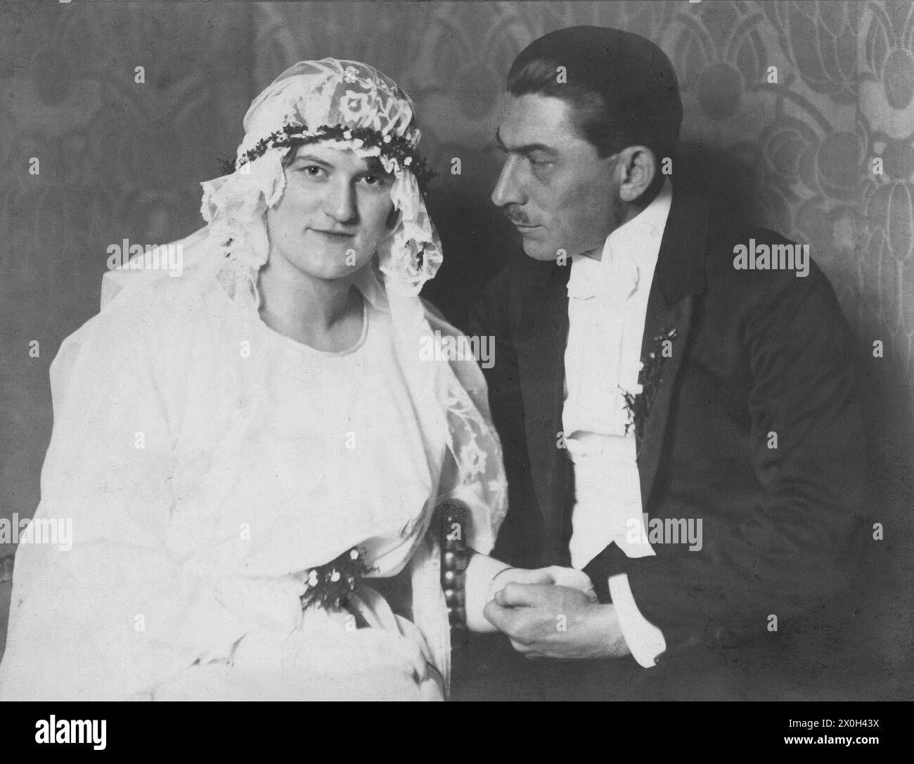 A bride and groom pose for the camera. [automated translation] Stock ...