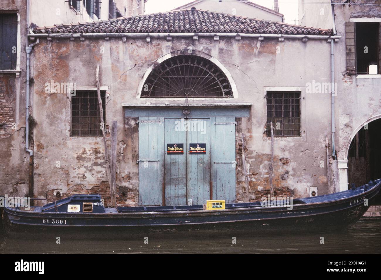A gondola lies in front of a beer outlet for Italia Pilsen. [automated ...