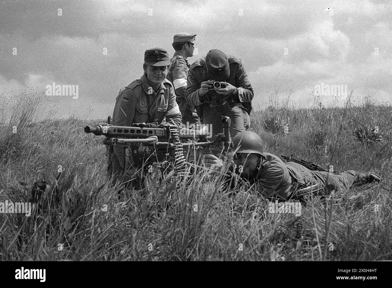 Troop exercise: A soldier shoots with the machine gun on the gun mount ...