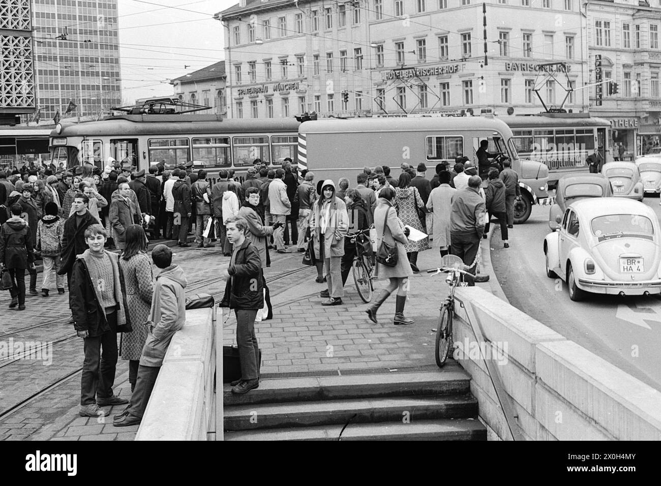 While a derailed streetcar is being pulled back onto the tracks in the ...