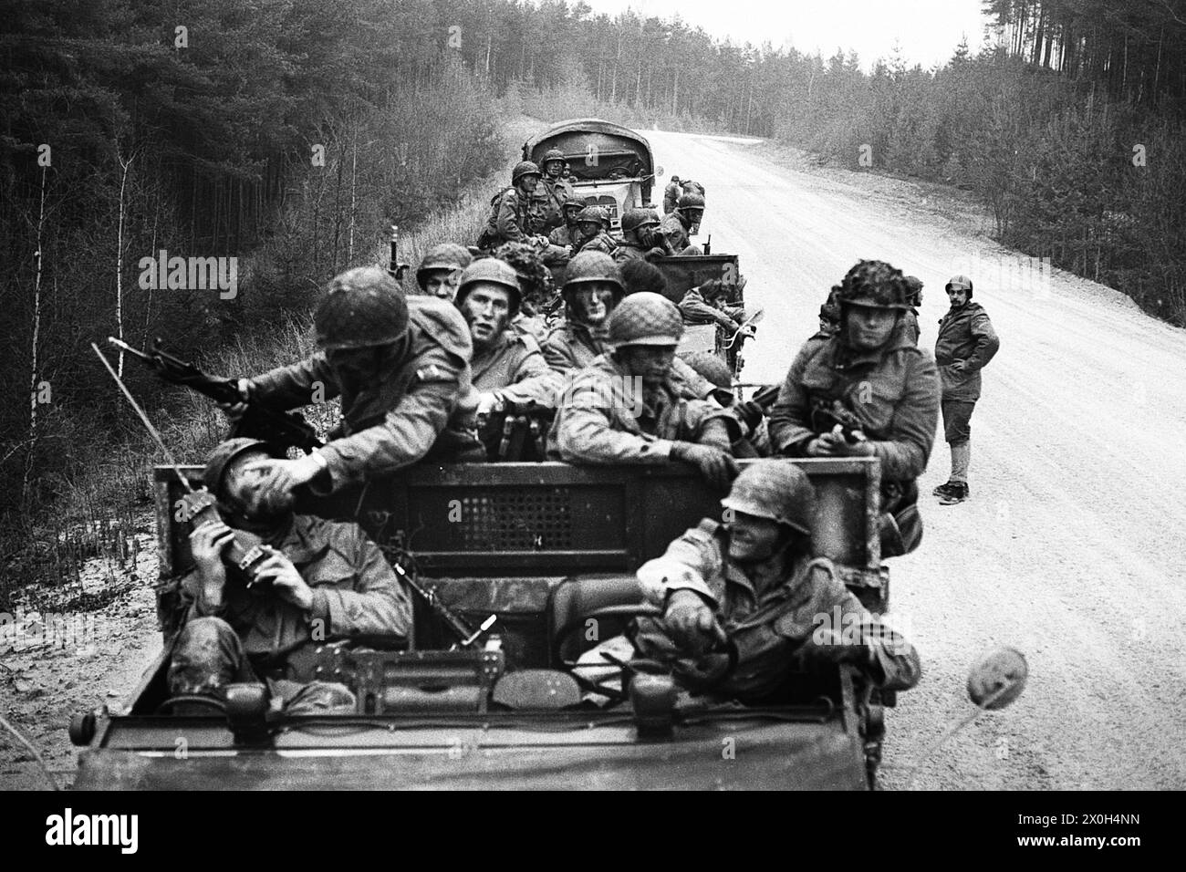 Troop exercise: Part of a convoy of vehicles waiting to continue their ...