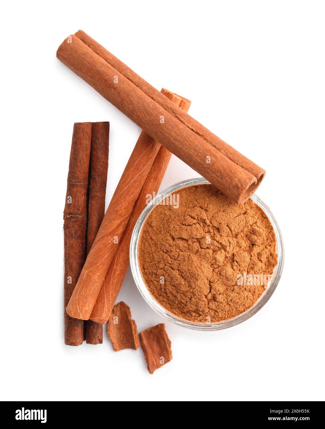 Dry aromatic cinnamon sticks and powder isolated on white, top view ...