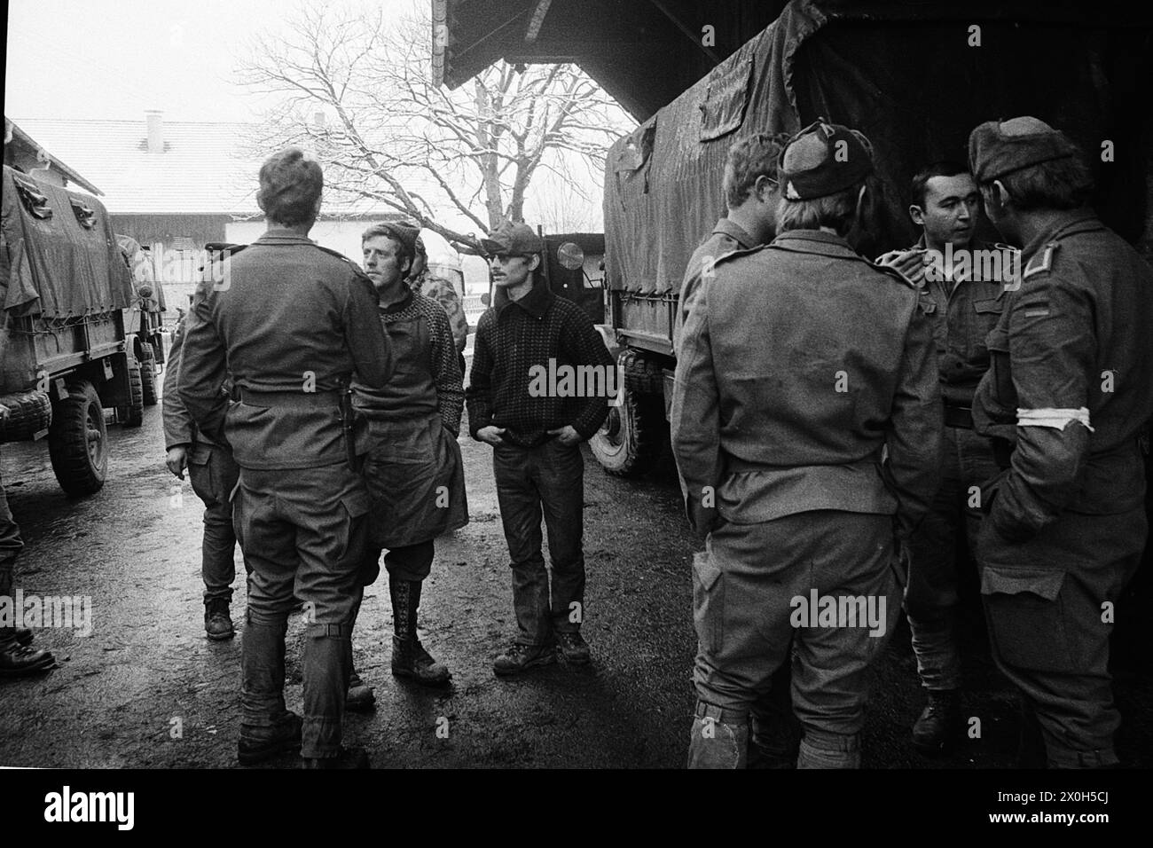 Troop exercise: resting with a farmer. The farmers talk to the soldiers ...