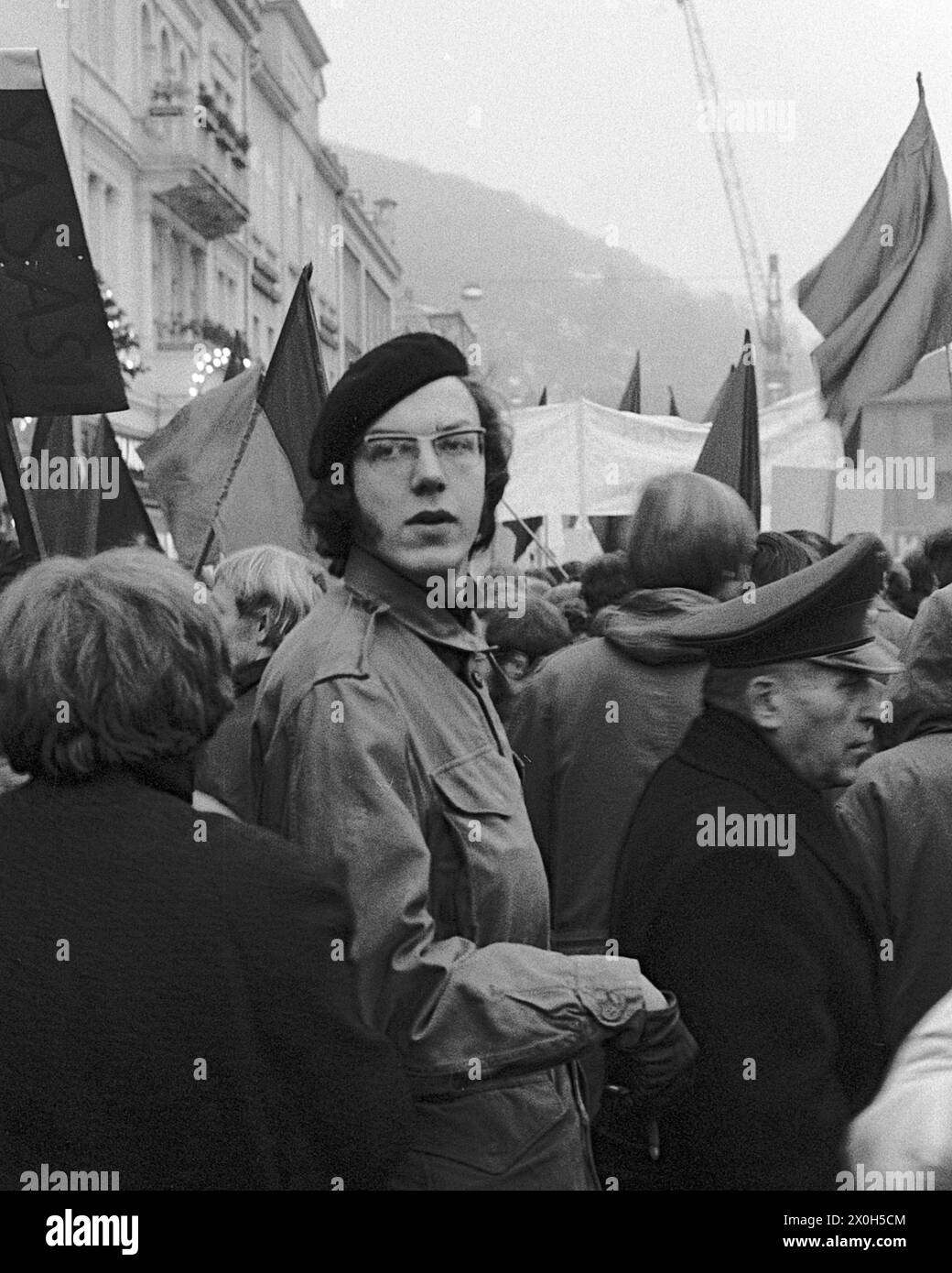 A streetcar conductor makes his way through the crowd of demonstrators ...