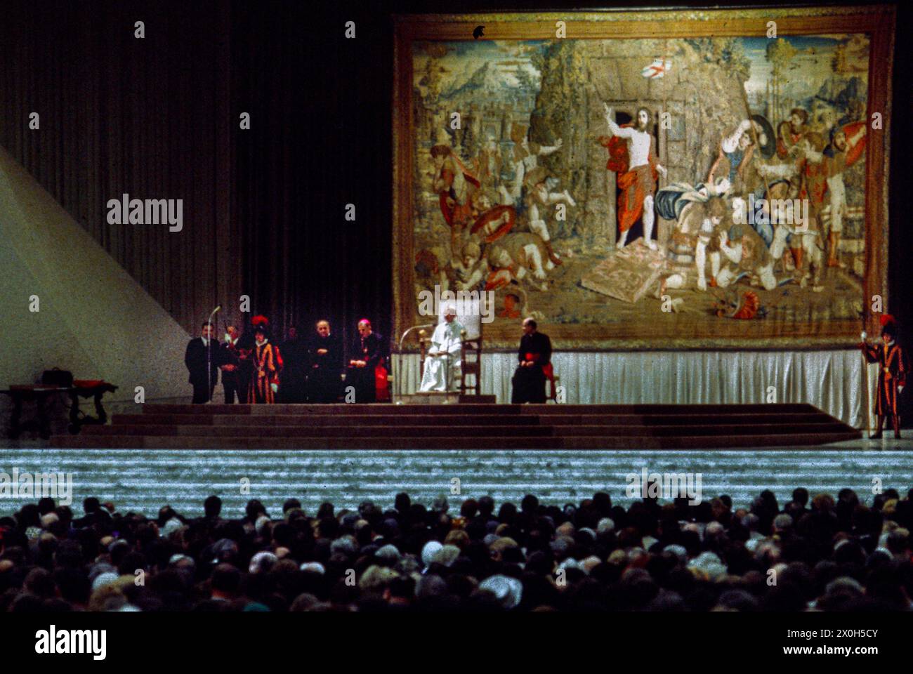 Pope Paul VI at his audience in the Vatican Audience Hall, surrounded by church dignitaries and ...