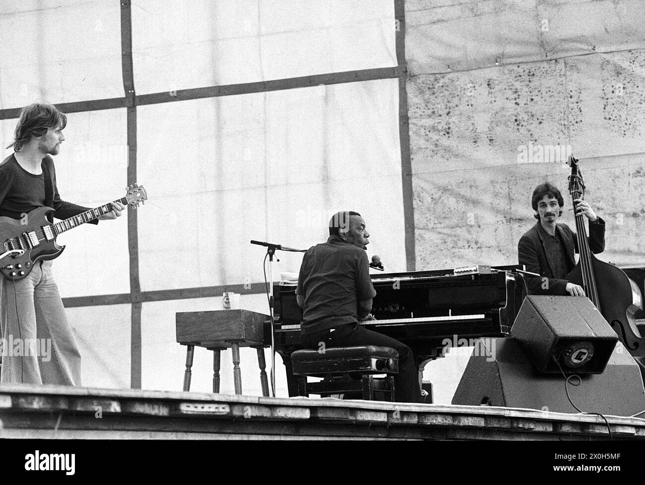 Champion Jack Dupree (on the grand piano) at a concert on the Zeppelin ...