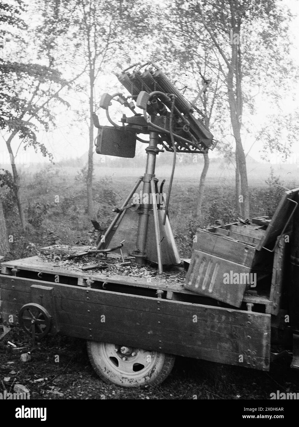 A gun carriage carrying four machine guns is mounted on the loading ...