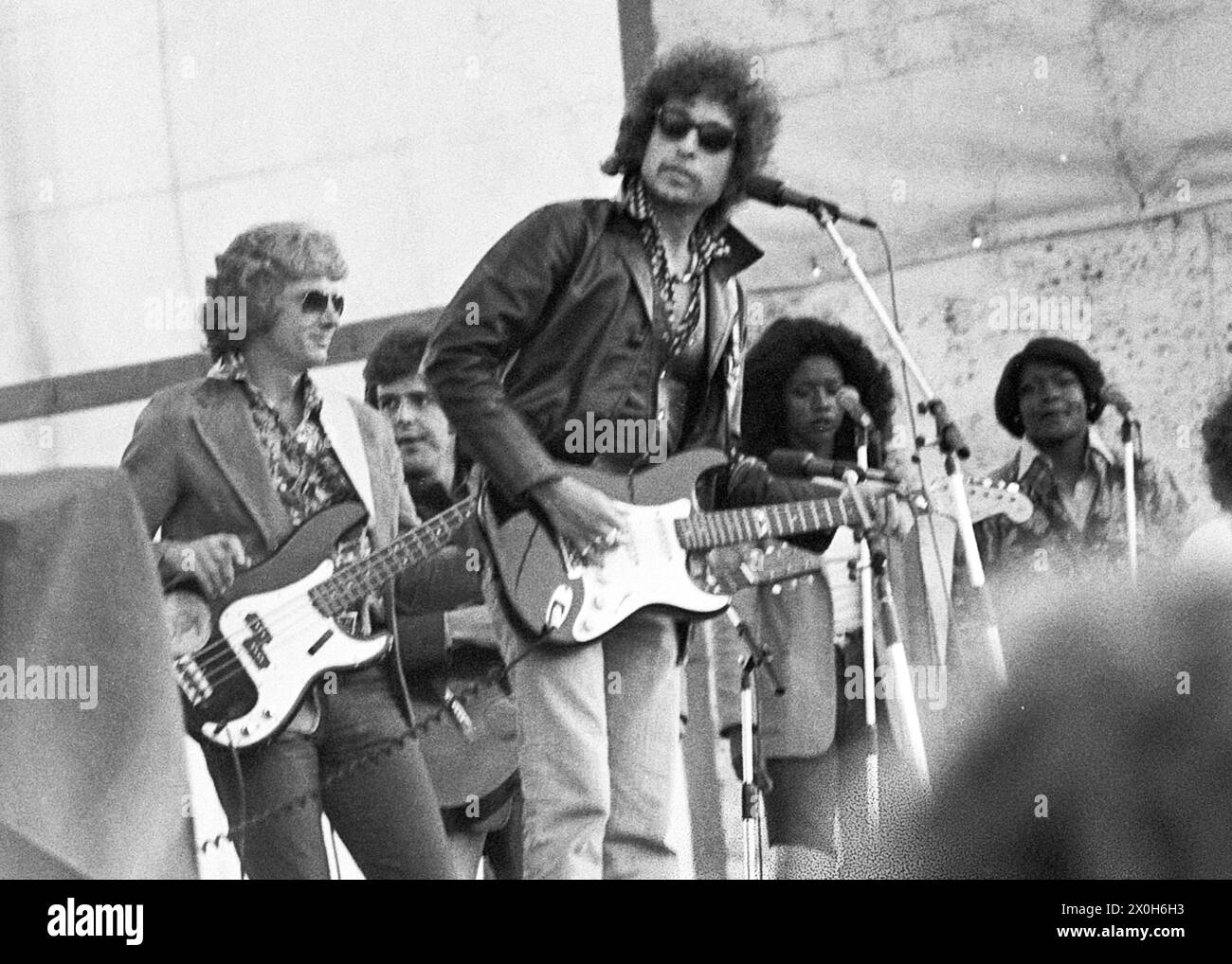 Bob Dylan at a concert on the Zeppelin Field in Nuremberg. Behind him ...