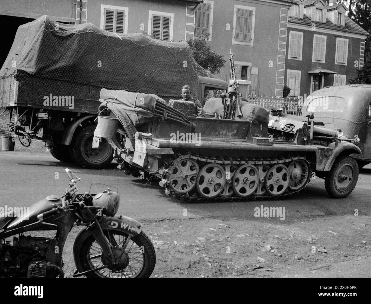 Light tractor unit 1 ton parked between a Wehrmacht truck and ...