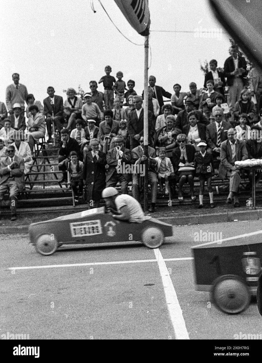 The many spectators in the packed stands witness a narrow victory ...