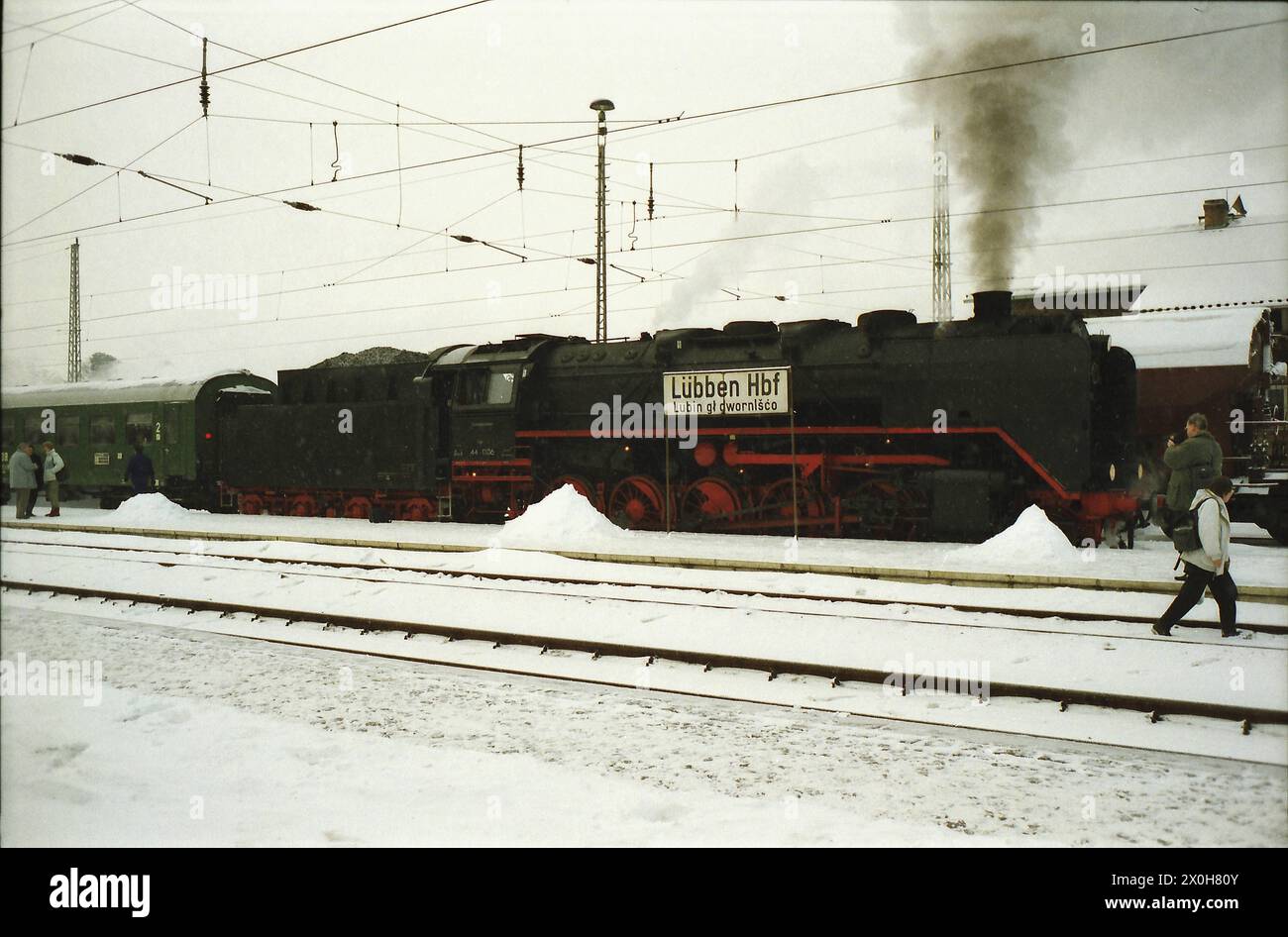 A class 44 locomotive in Lübben in front of a passenger train arrives ...