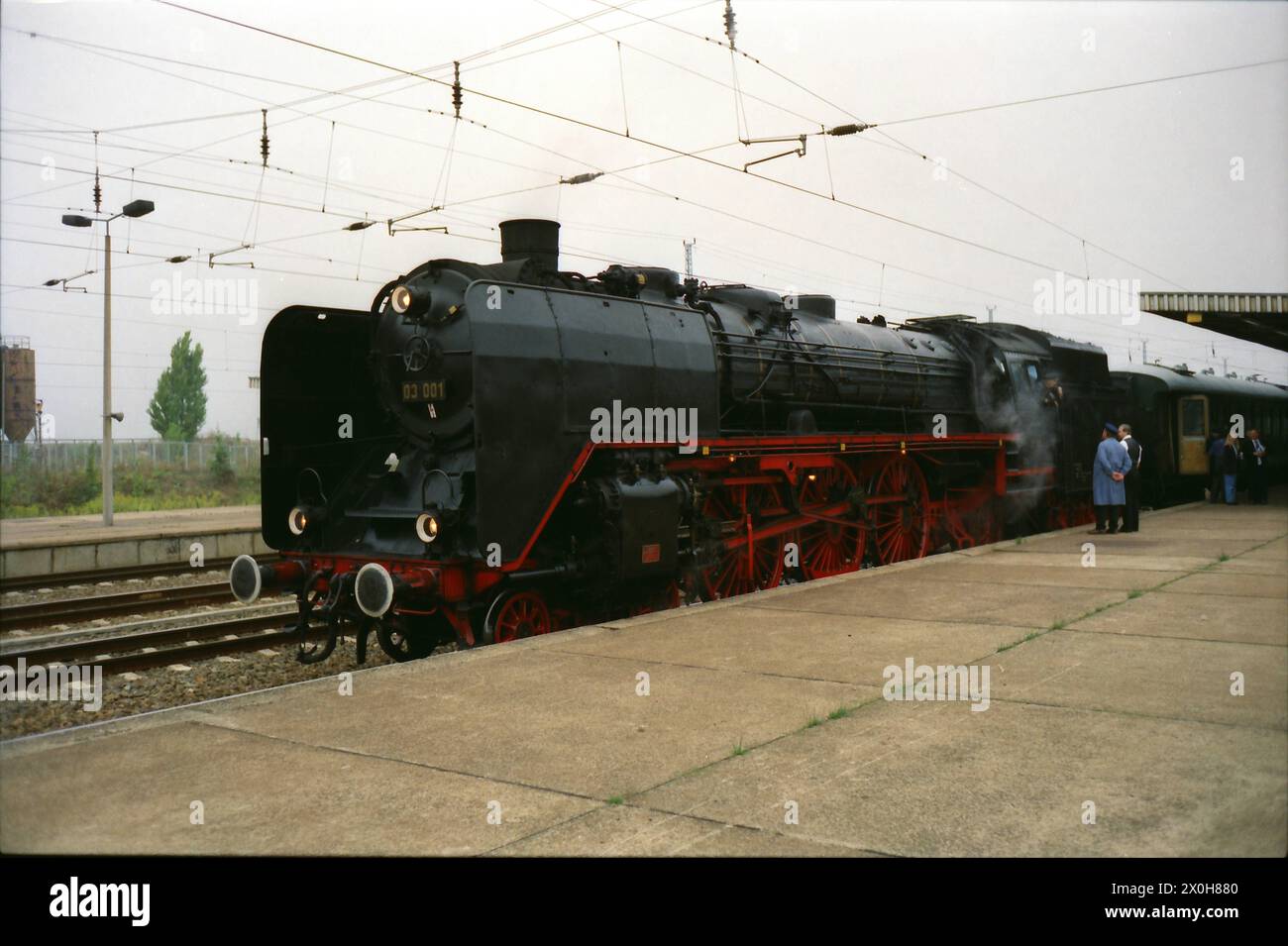 A nostalgic class 03 steam locomotive is probably at Schönefeld station ...