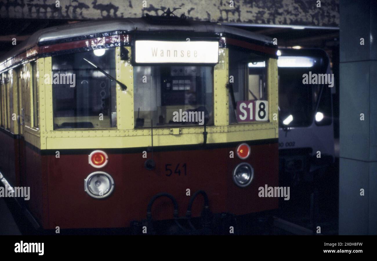 next to the new type 480 train in the background, a light rail train ...