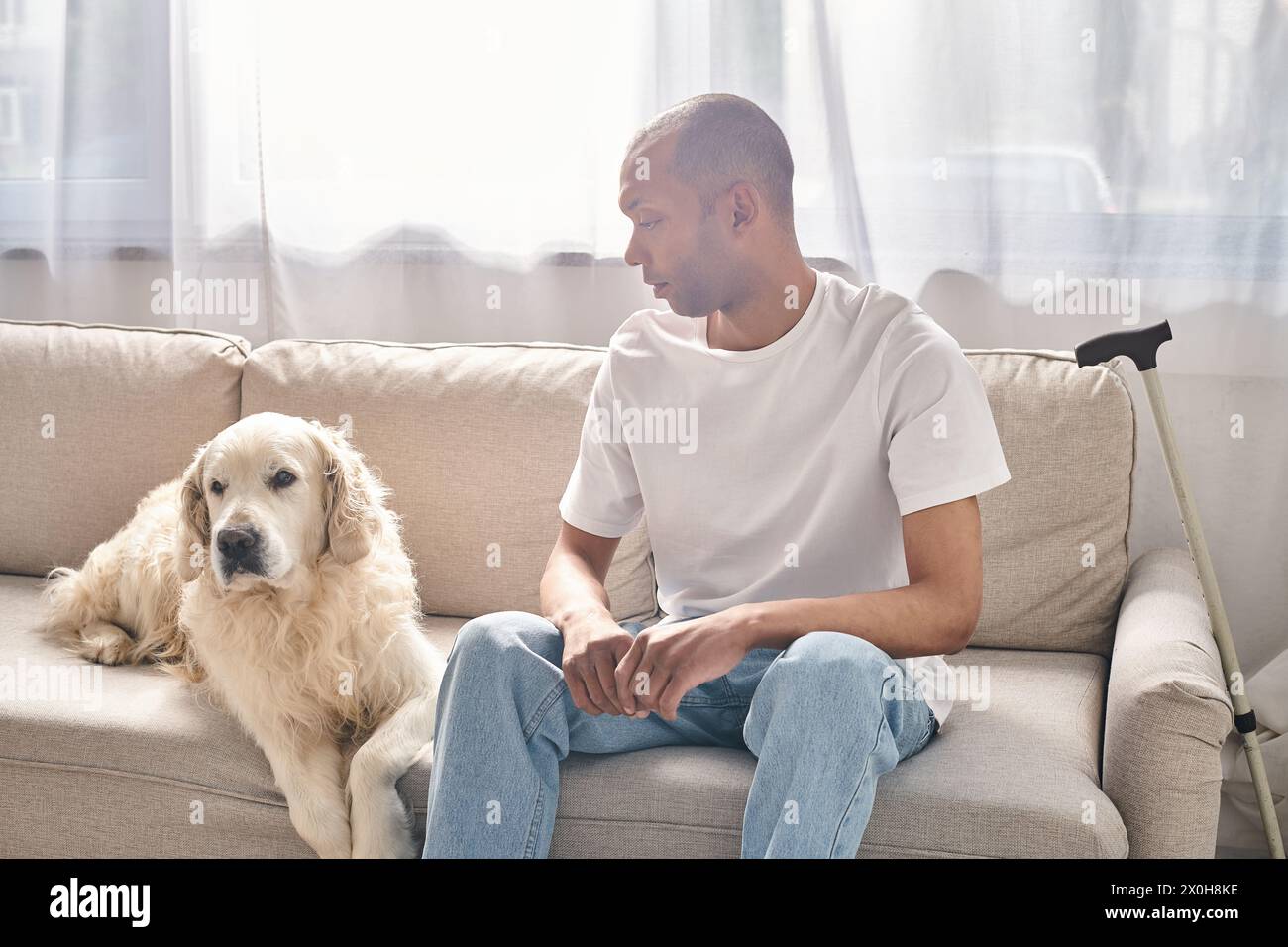 A disabled African American man with myasthenia gravis relaxes on a ...