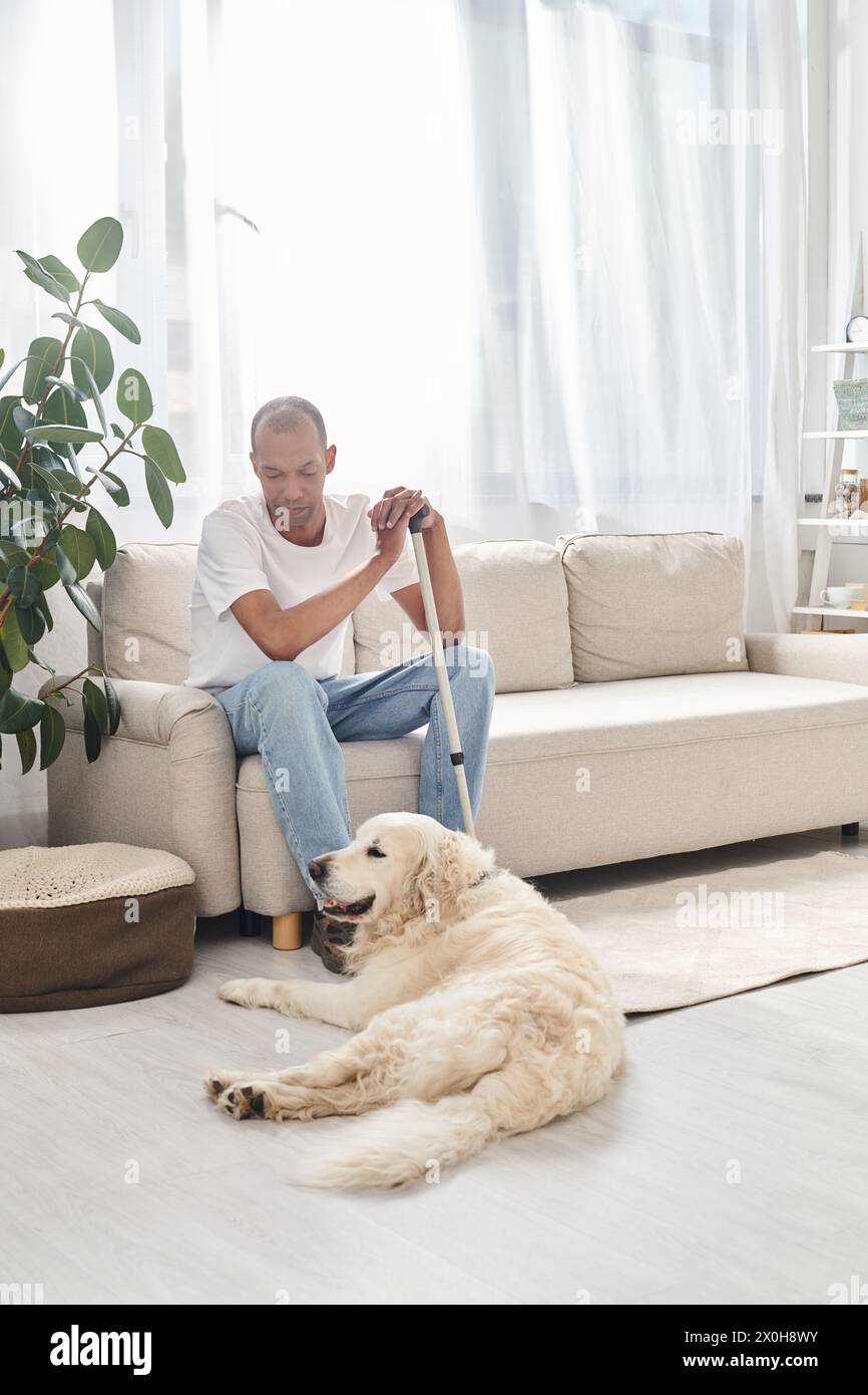 A disabled African American man with myasthenia gravis relaxes on a ...