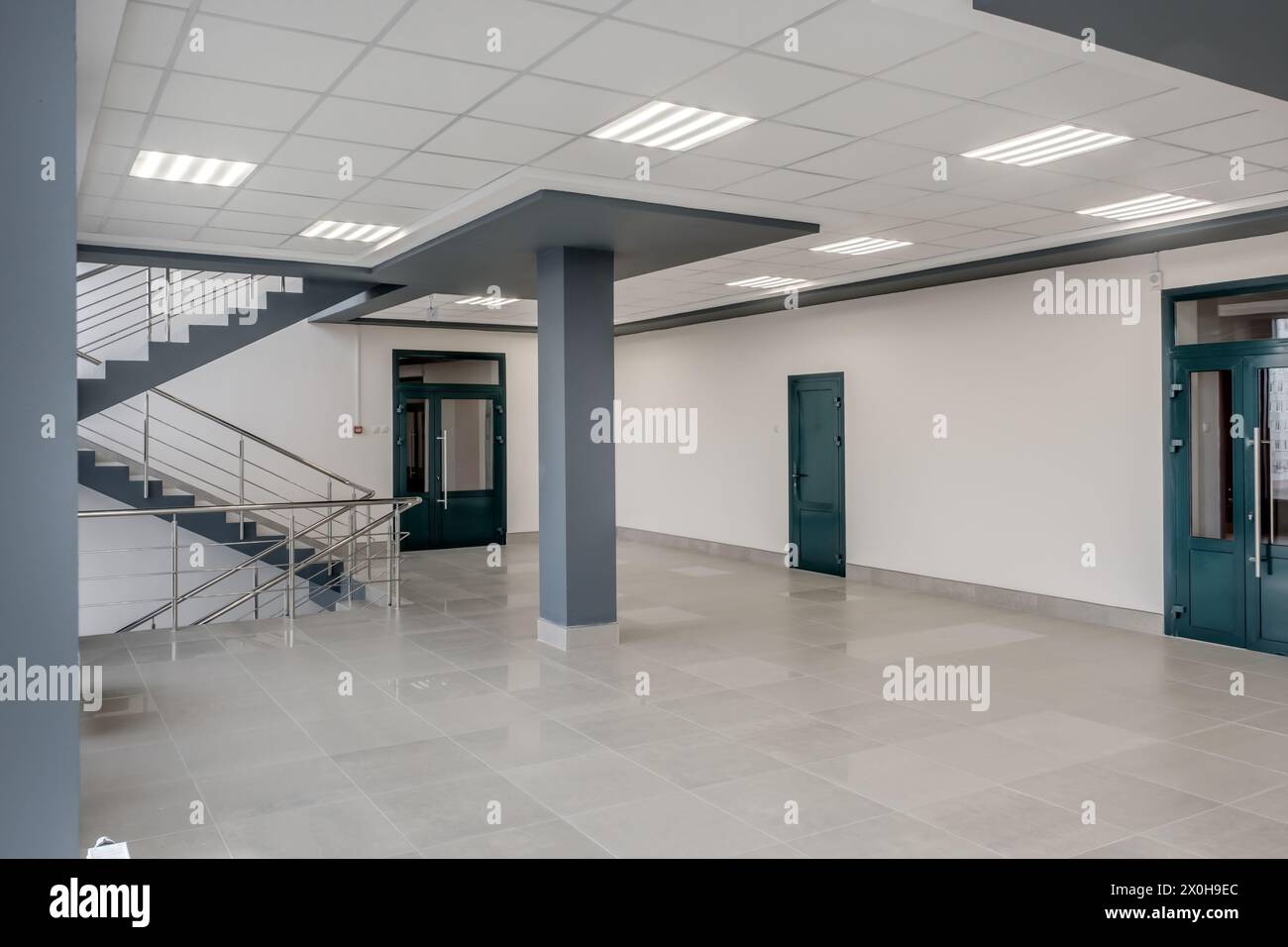 panorama view in empty modern hall with columns, doors, stairs and ...