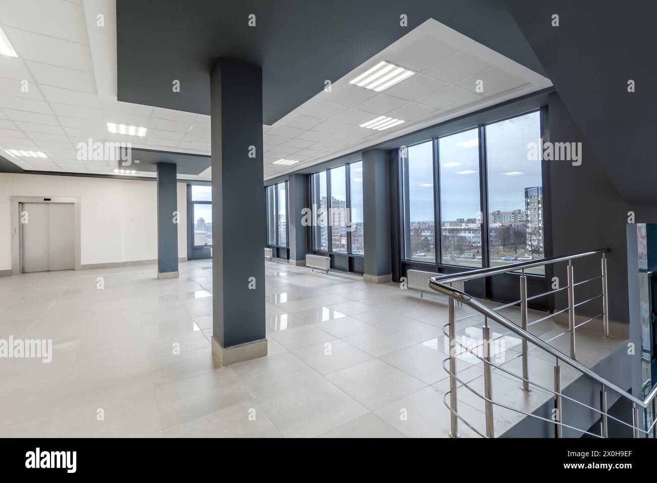 panorama view in empty modern hall with columns, doors, stairs and ...