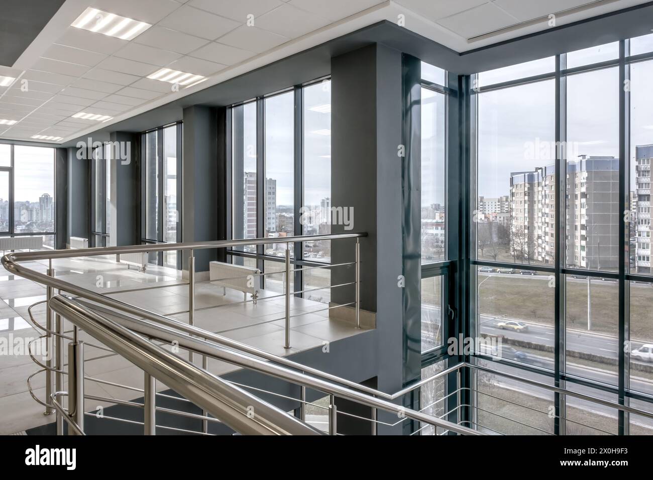 panorama view in empty modern hall with columns, doors, stairs and ...