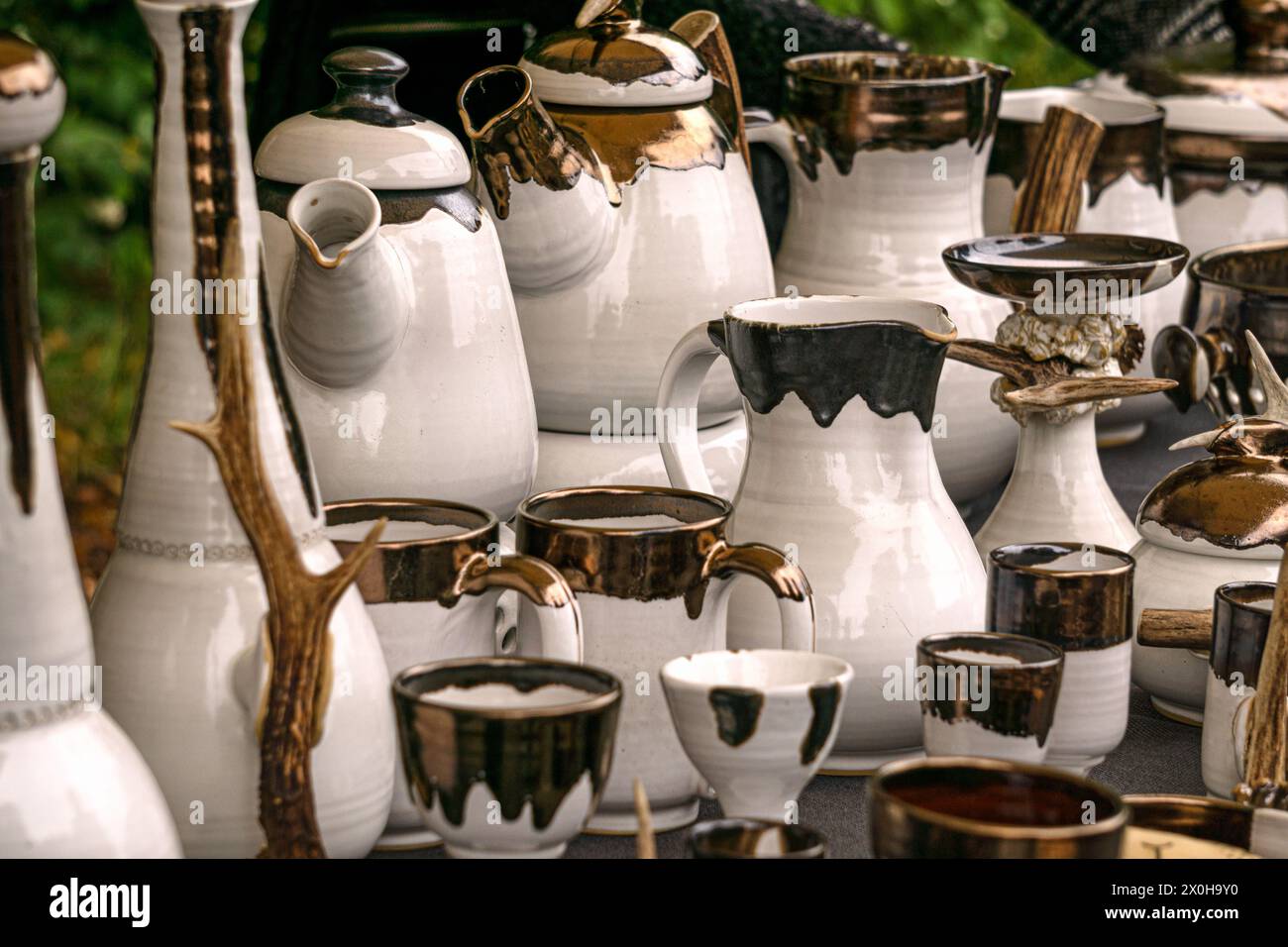 Handmade glazed clay pottery using wild animal horns Stock Photo - Alamy