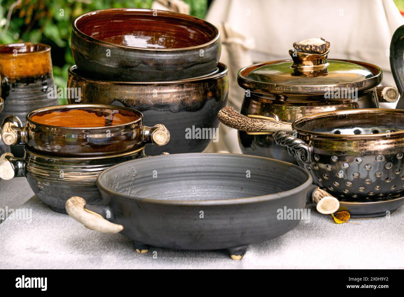 Handmade glazed clay pottery using wild animal horns Stock Photo - Alamy