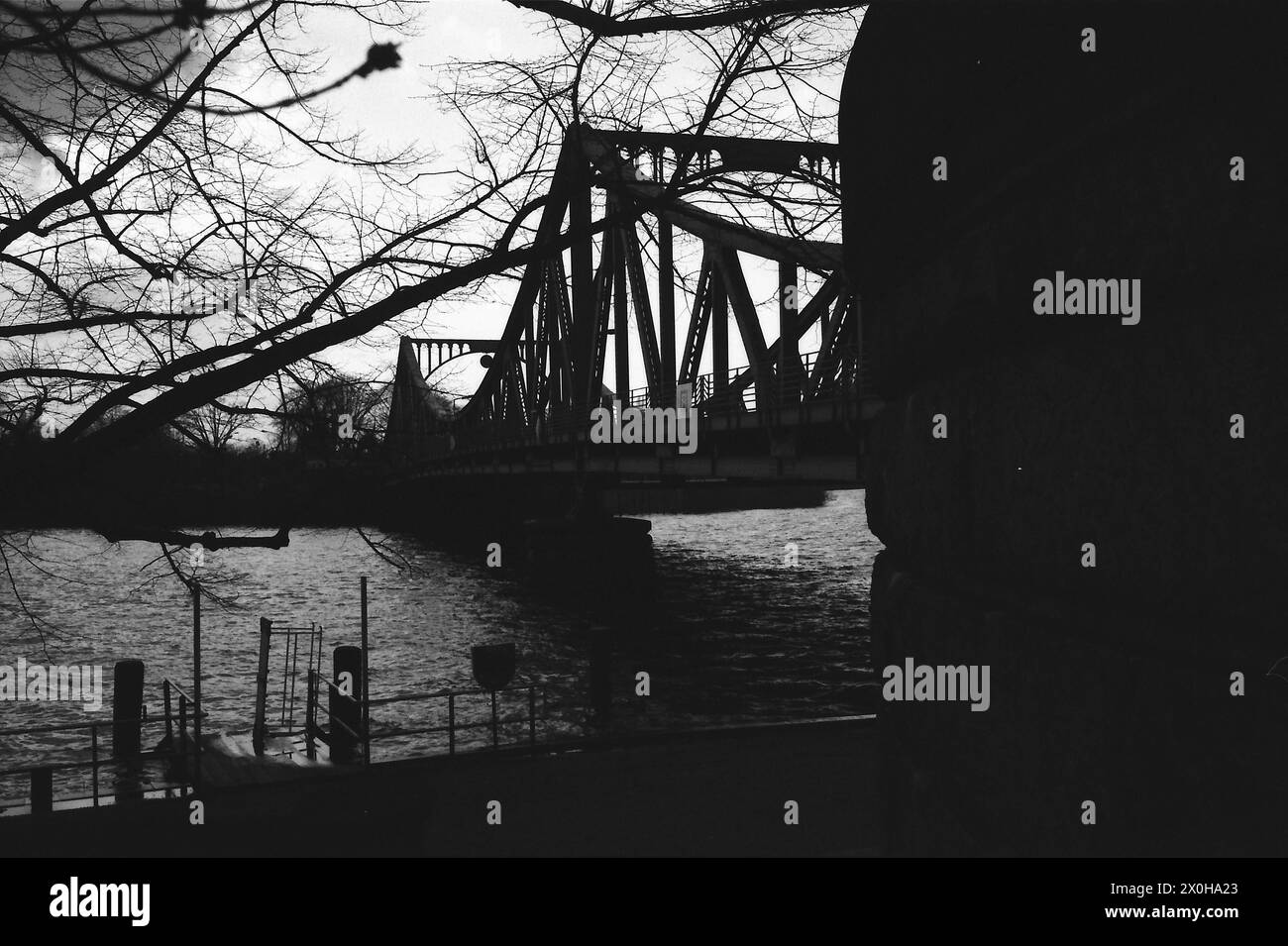 Like a silhouette, the Glienicke Bridge spans the Havel and separates ...