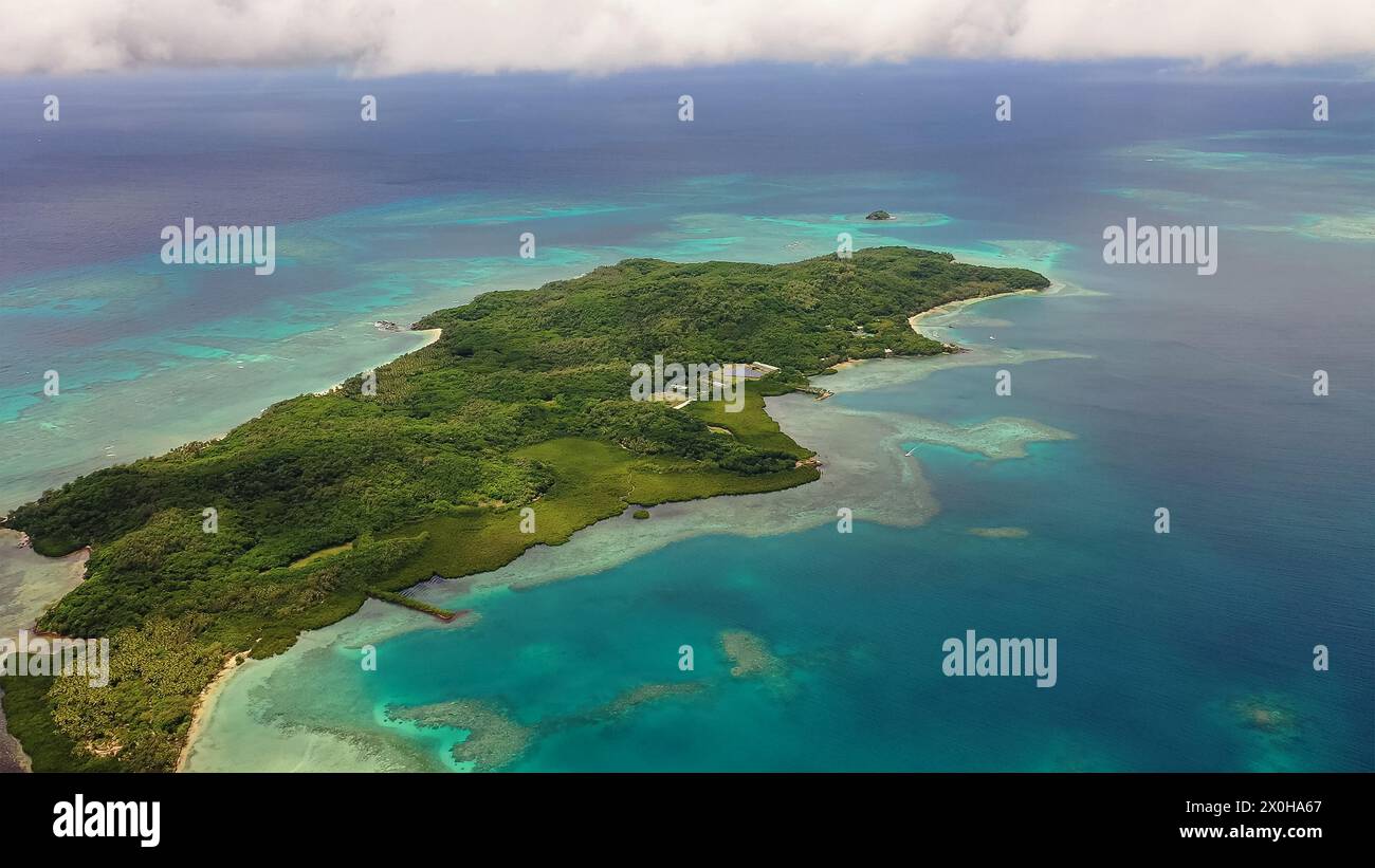 Fiji Islands. Turquoise waters of ocean wash island covered tropical ...