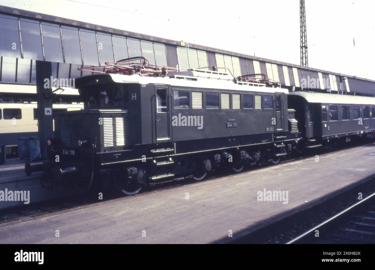 The historic locomotive E44 119 stands in front of historic express ...