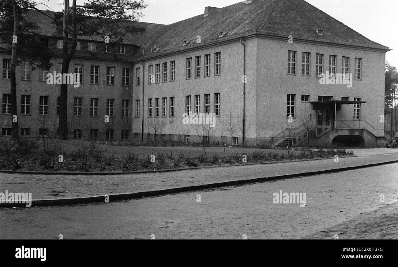 The picture shows a double school, the elementary school with name, the ...