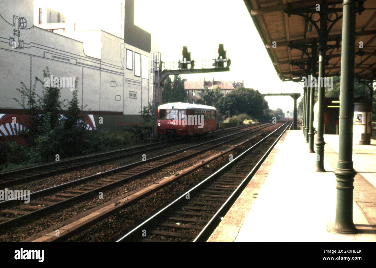A DR rail bus passes Savignyplatz station on the mainline tracks. As is ...