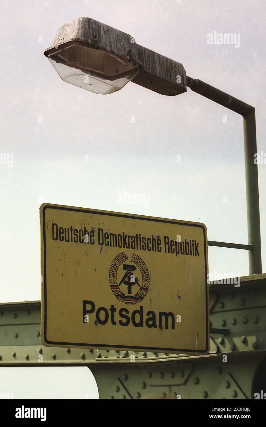 A Potsdam town sign with the seal of the German Democratic Republic ...