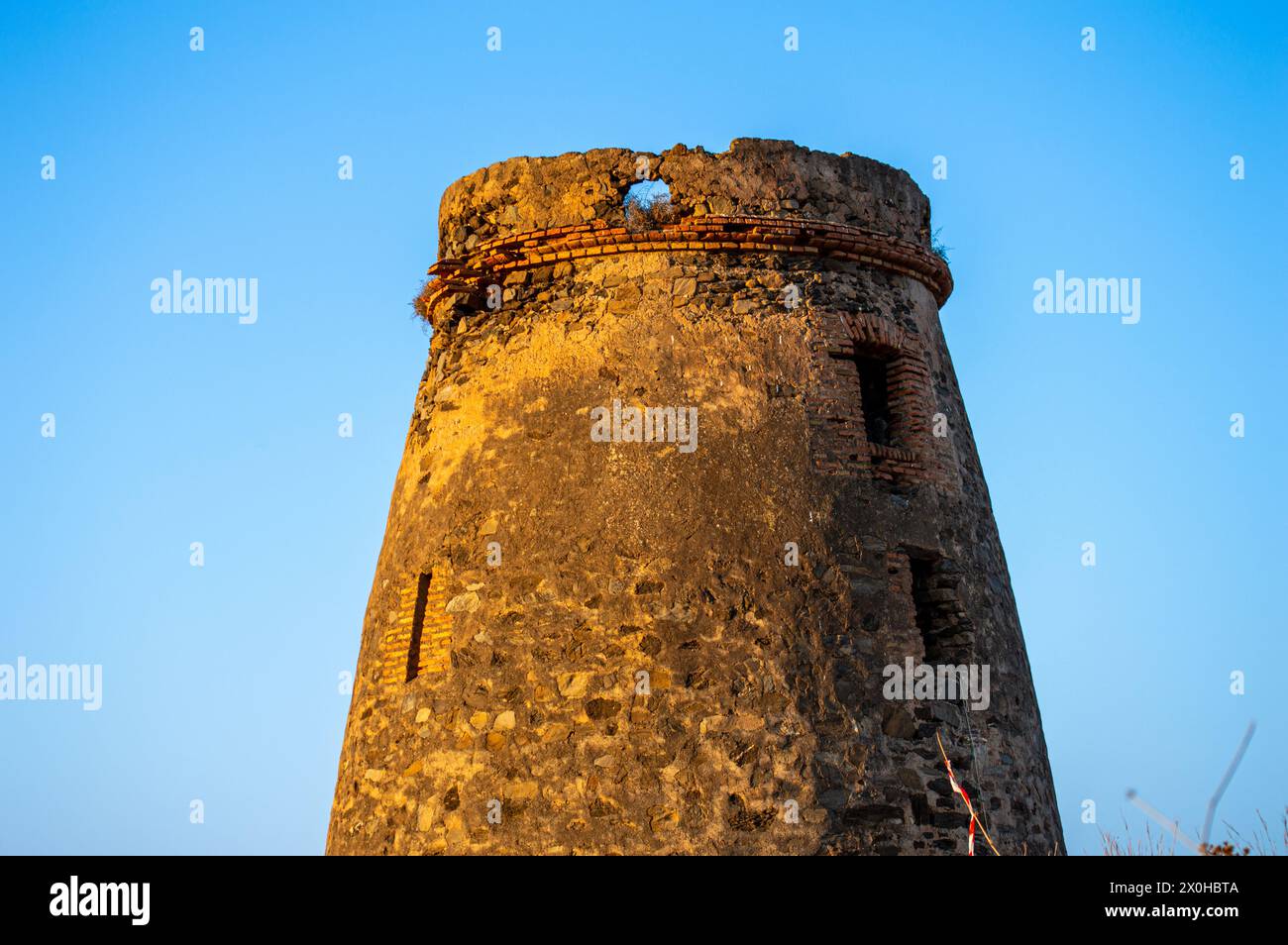 Sunrise over Mediterranean sea. Historic Torre Vigia De Cerro Gordo, a ...