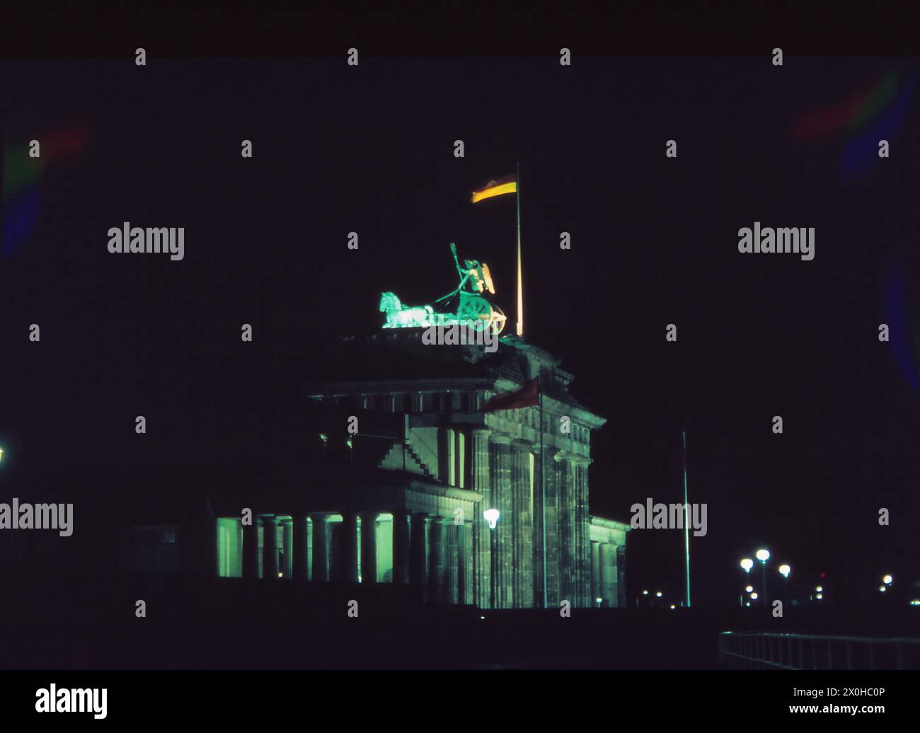 The colored light reflections of the neighboring spotlights outside the ...