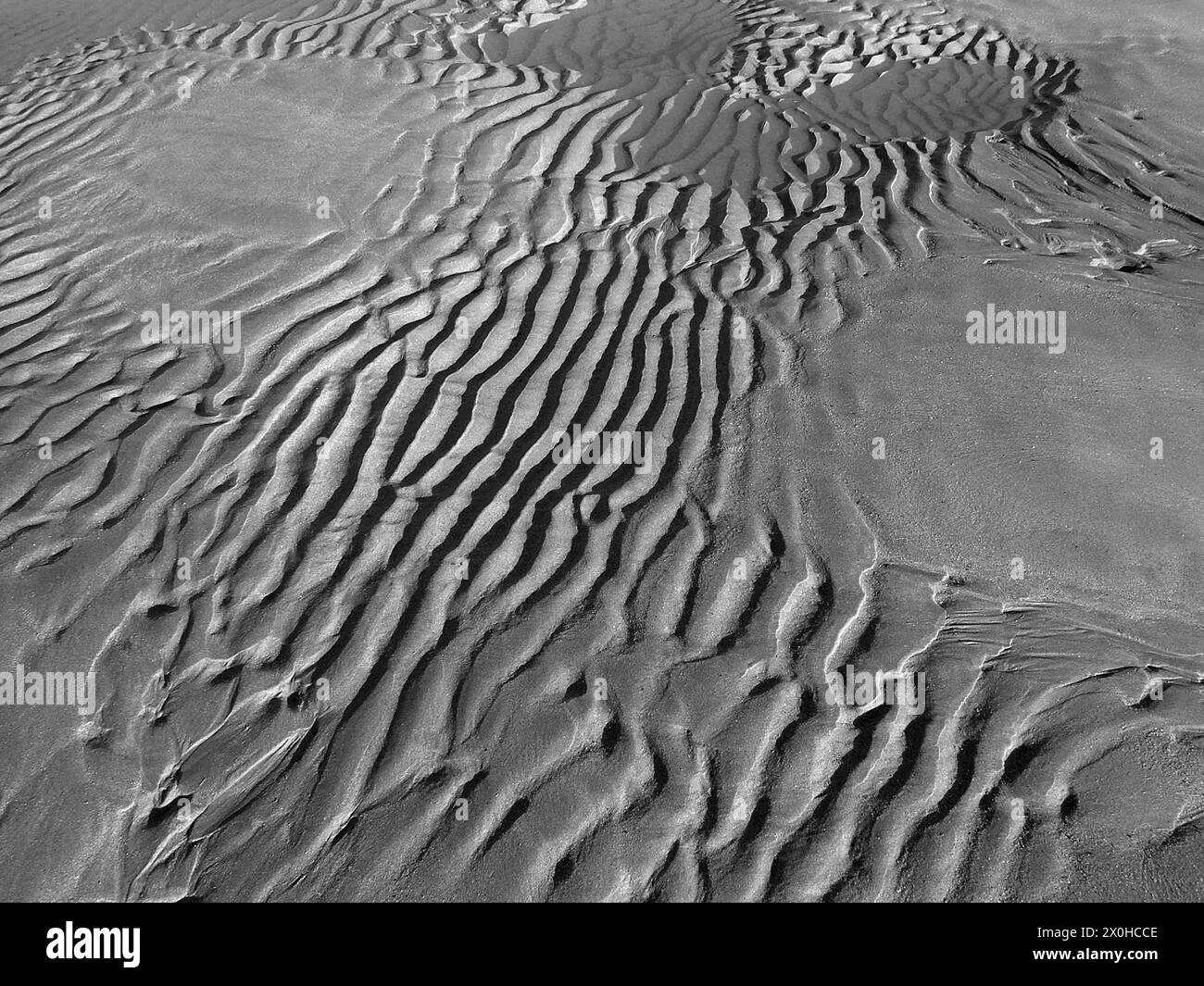Sand formations during low tide on the Grande Côte before La Barre de ...