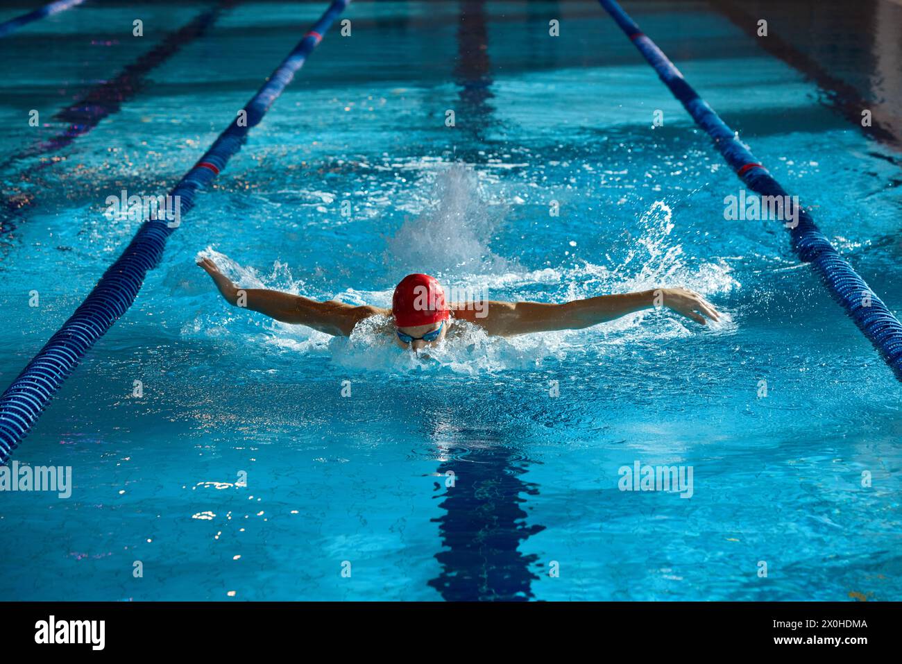 Athleticism in action. Young muscular man, swimmer in motion, action ...