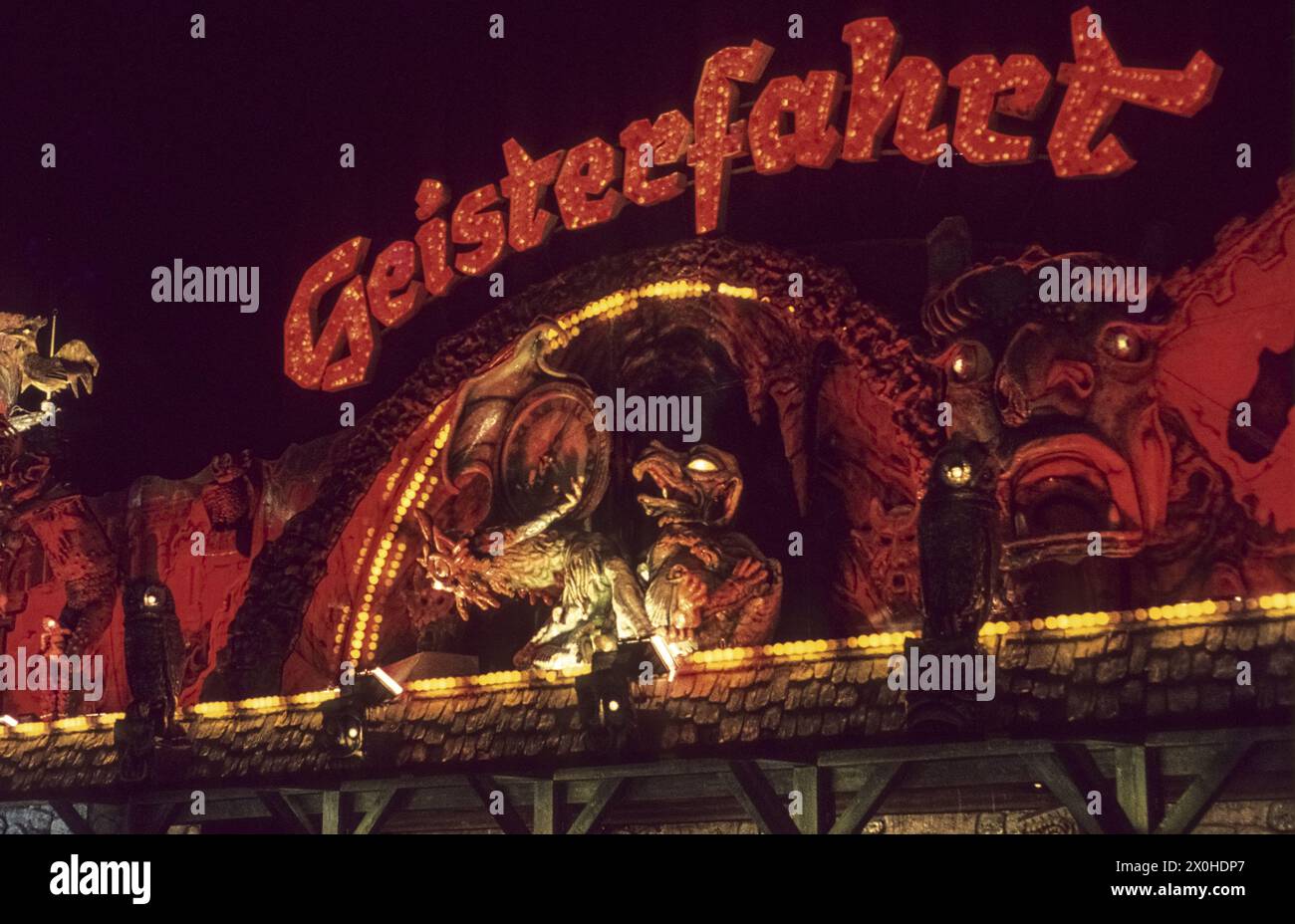 A ghost train at the Munich Oktoberfest at night. [automated ...