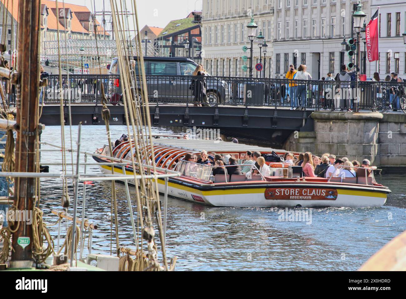 Canal tours Copenhagen boat passing under Nyhavnsbroen bridge Nyhavn ...
