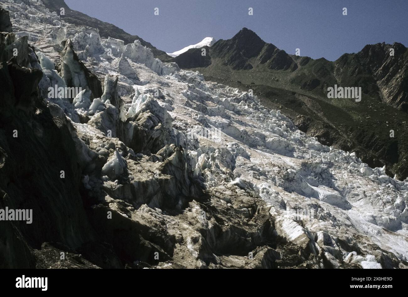Detail of the glacier in front, the Aiguille du GoÃ»ter behind ...