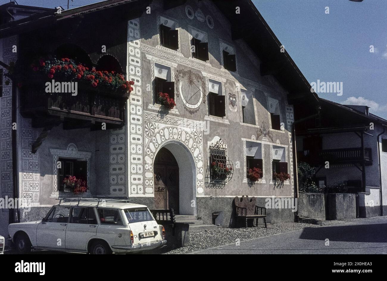 House in typical Engadine style with sgraffito technique. [automated ...