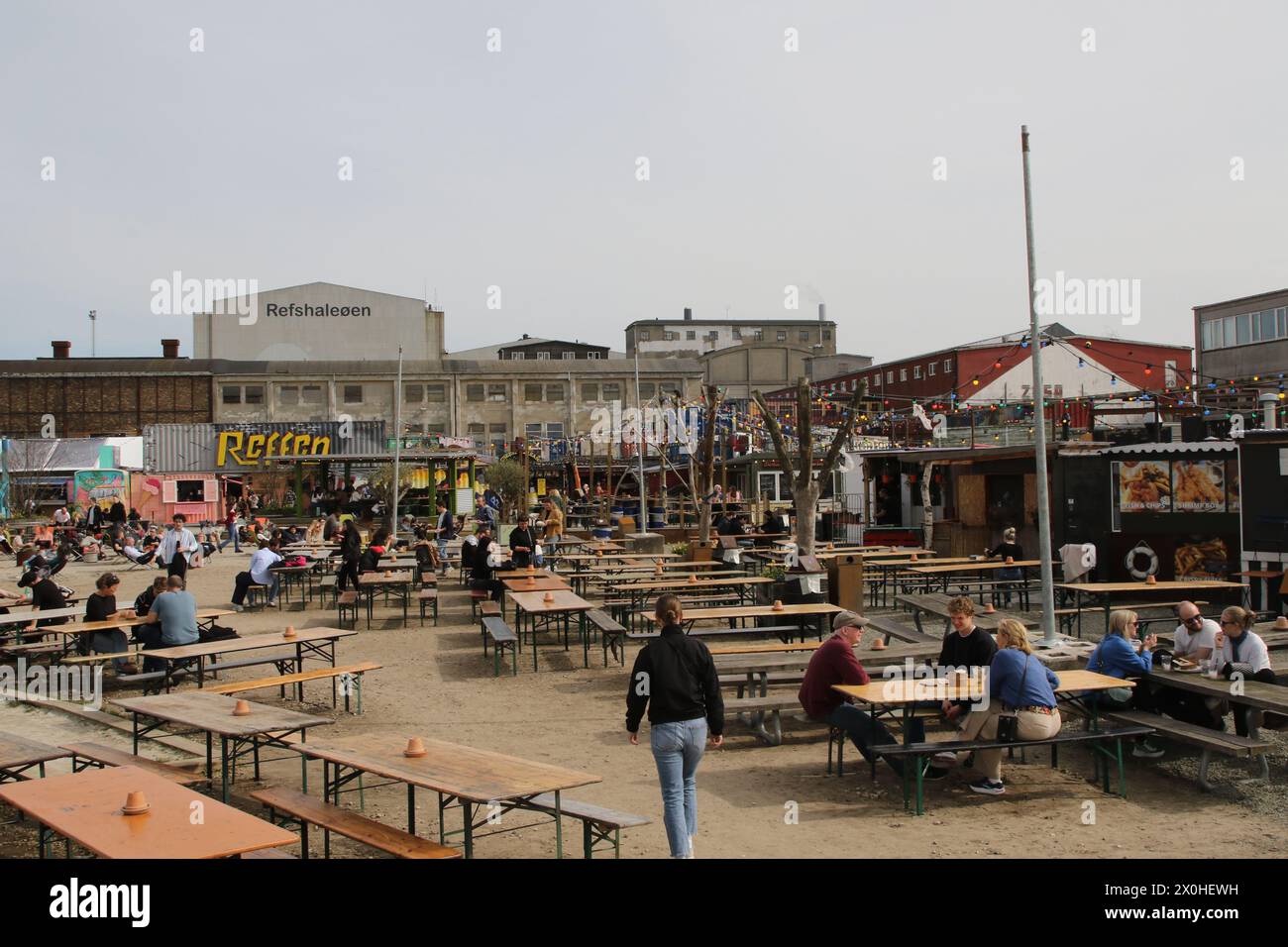 People sitting on sun loungers and at tables Refen Copenhagen Denmark ...