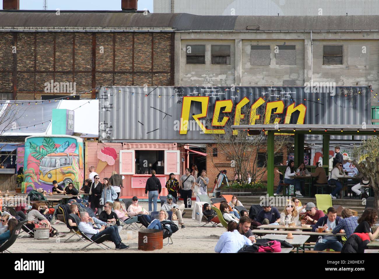 People sitting on sun loungers and at tables Refen Copenhagen Denmark ...