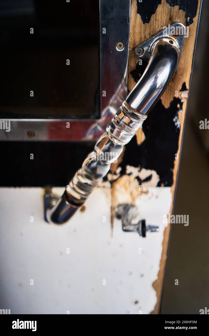 clear glass handle on a ship's sliding door Stock Photo - Alamy