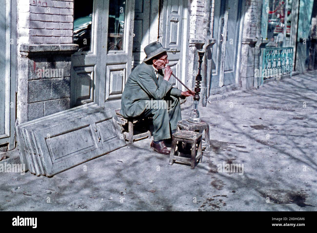 A man smoking hookah in Multan, Pakistan in 1960 Stock Photo - Alamy